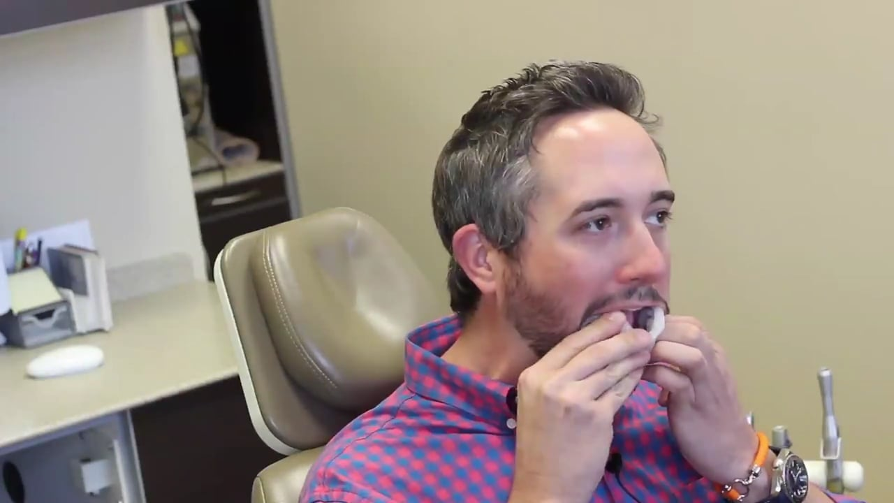 Joshua Austin, DDS, FAGD, demos the OptraGate lip and cheek retractor ...